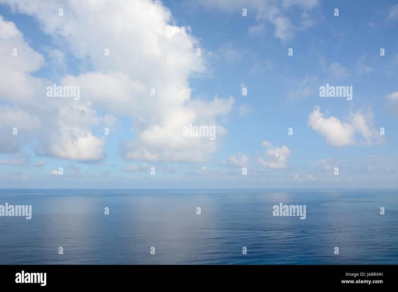 Beautiful seascape with ocean under blue sky Stock Photo - Alamy
