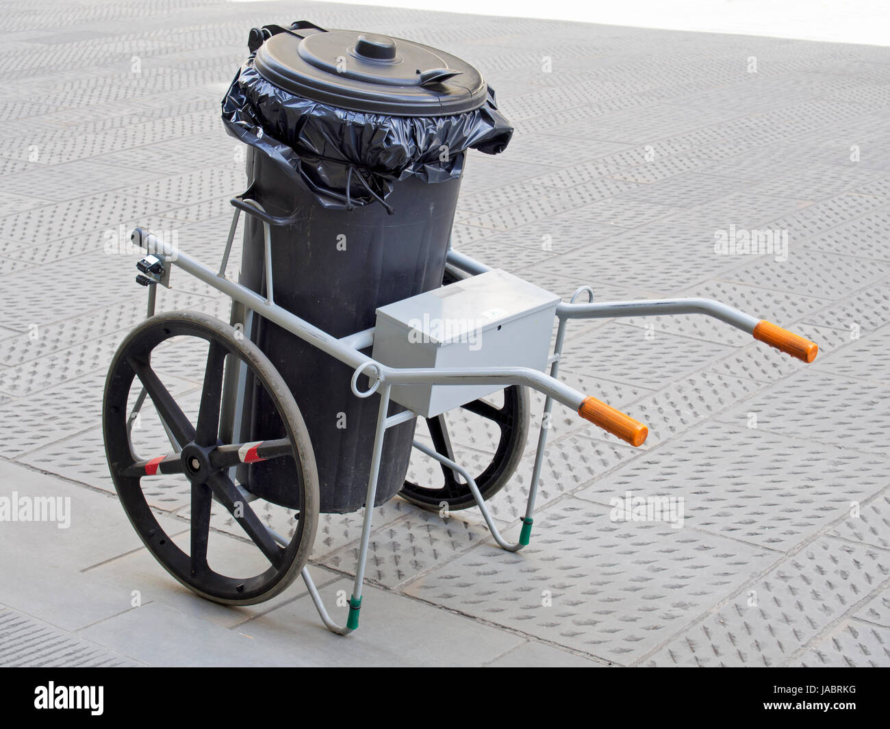 garbage bin on wheels for having road paving clean Stock Photo - Alamy