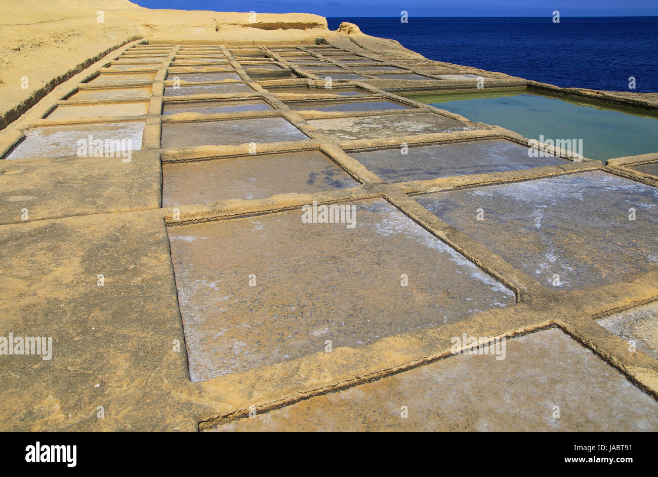 Historic ancient salt pans on coast near Marsalforn, island of Gozo ...