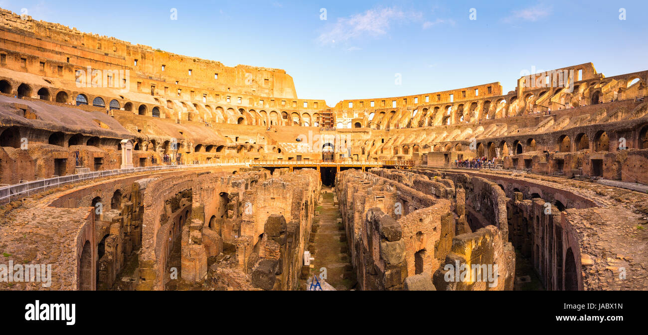 Panoramic view of Roman colosseum interior at colorful sunset, Rome ...