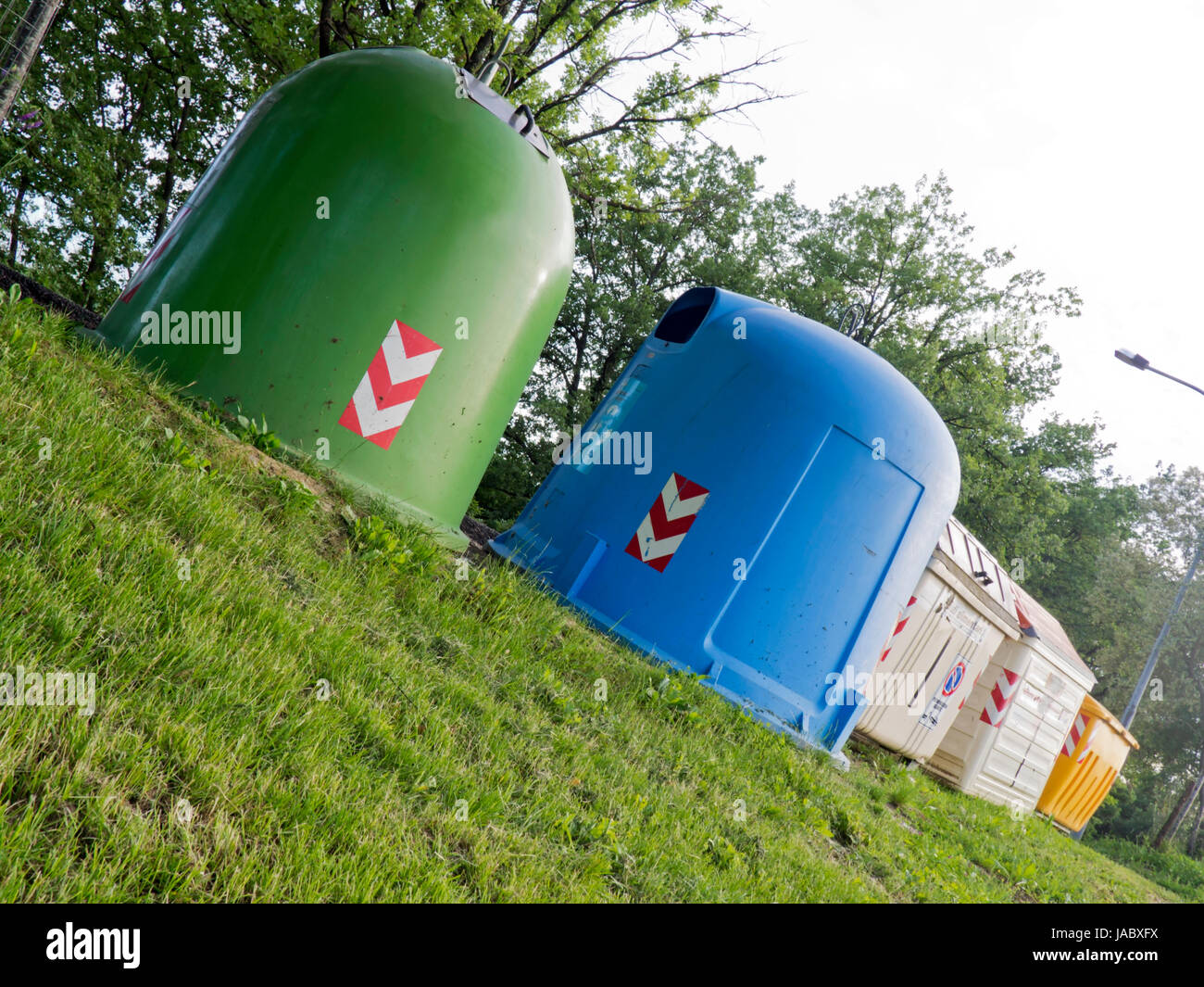 differentiated waste collection on the green lawn Stock Photo - Alamy