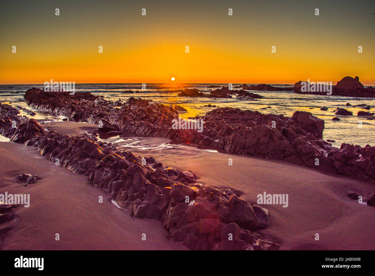 Sunset over the Atlantic at Widemouth Bay Stock Photo - Alamy