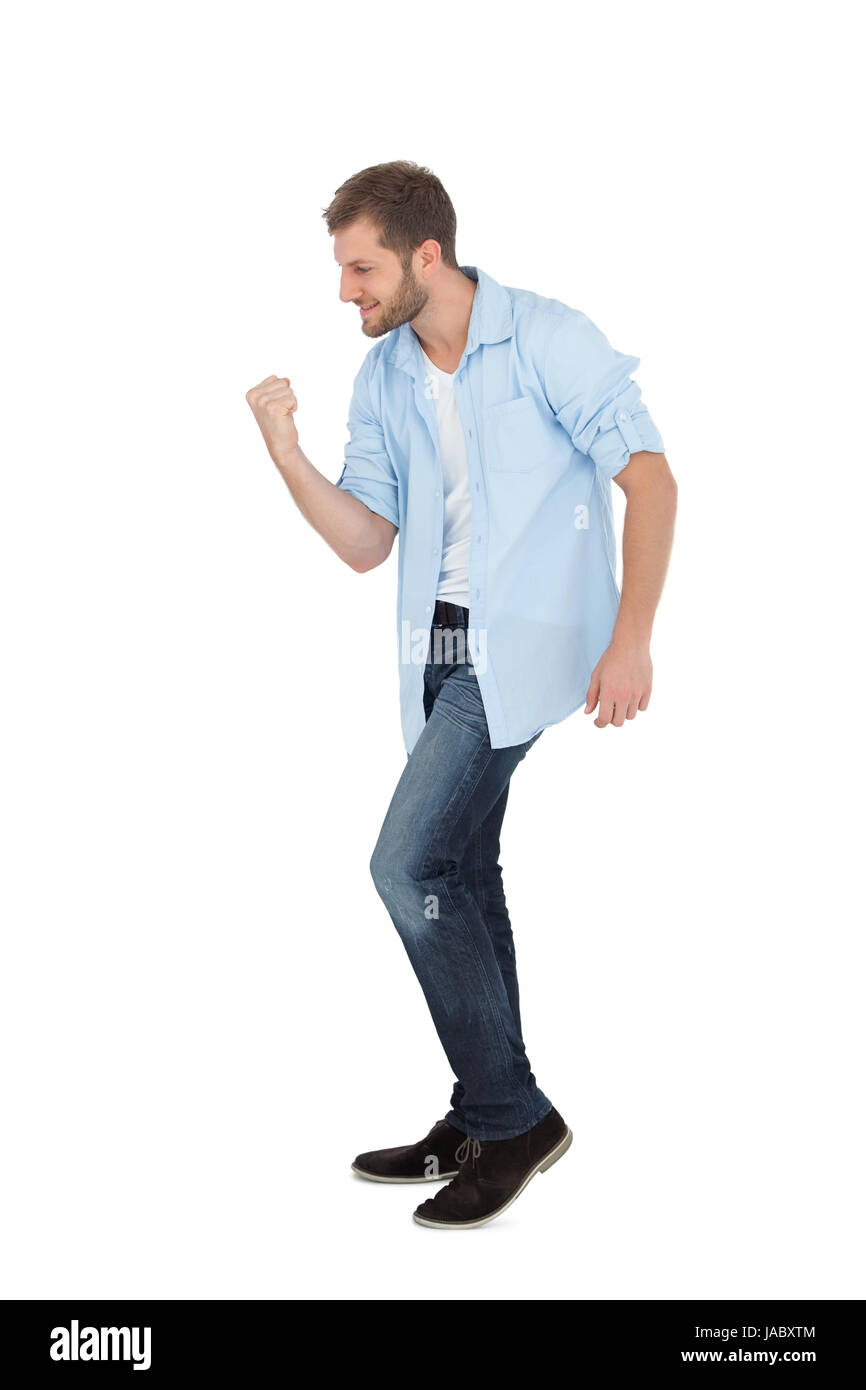 Handsome man cheering on white background Stock Photo - Alamy