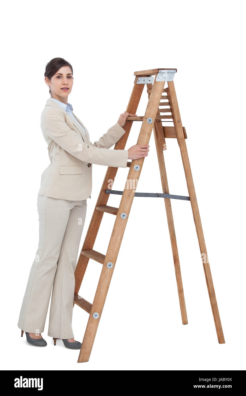 Businesswoman at the bottom of the career ladder on white background ...