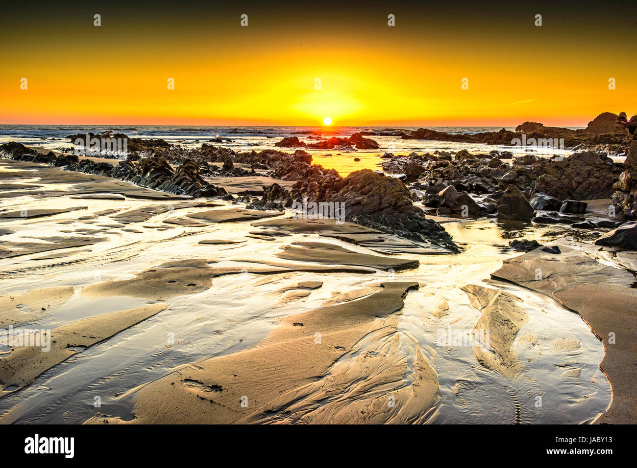 Sunset over the Atlantic at Widemouth Bay Stock Photo - Alamy