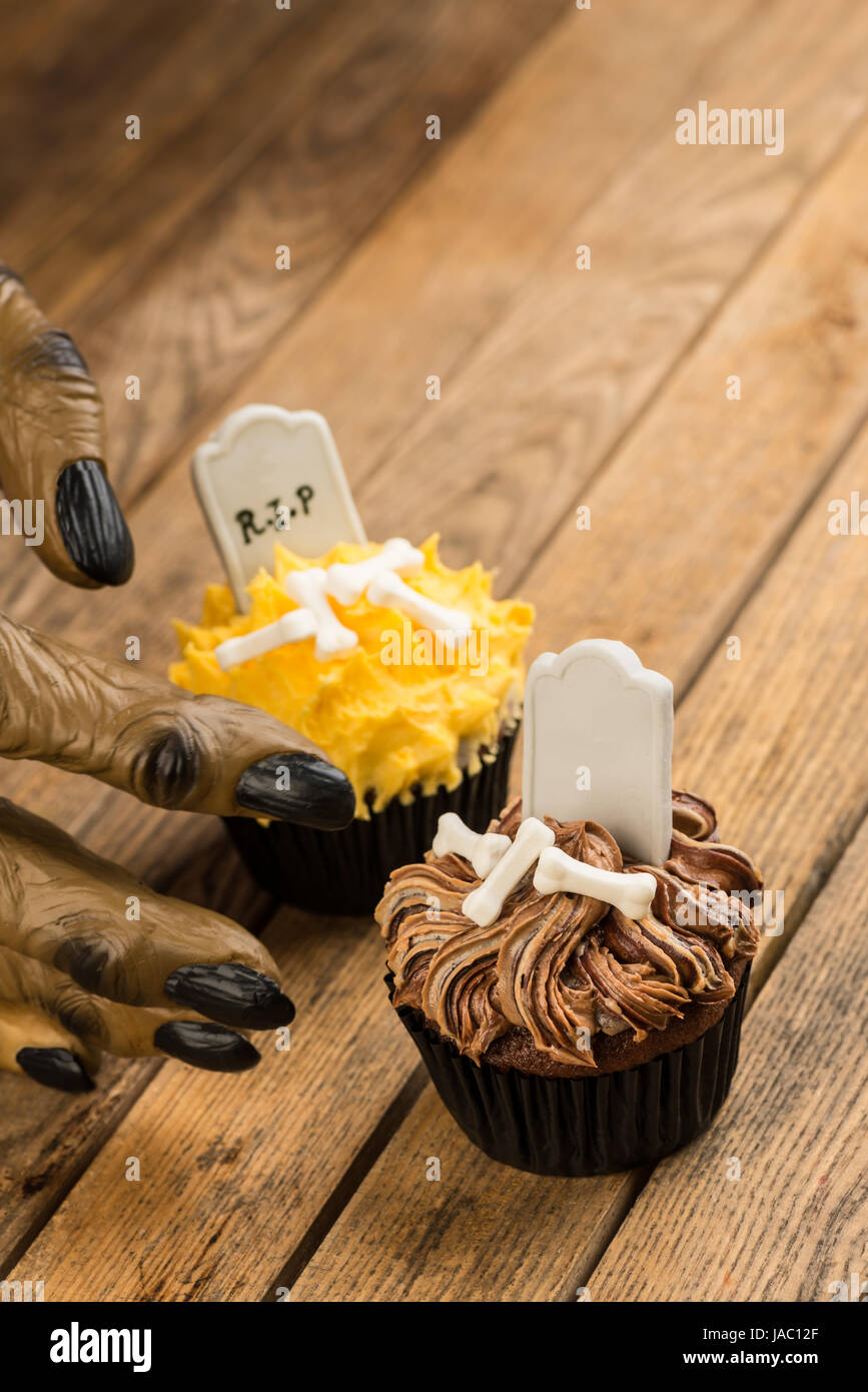 Werewolf hand reaching for a Halloween cup Stock Photo - Alamy