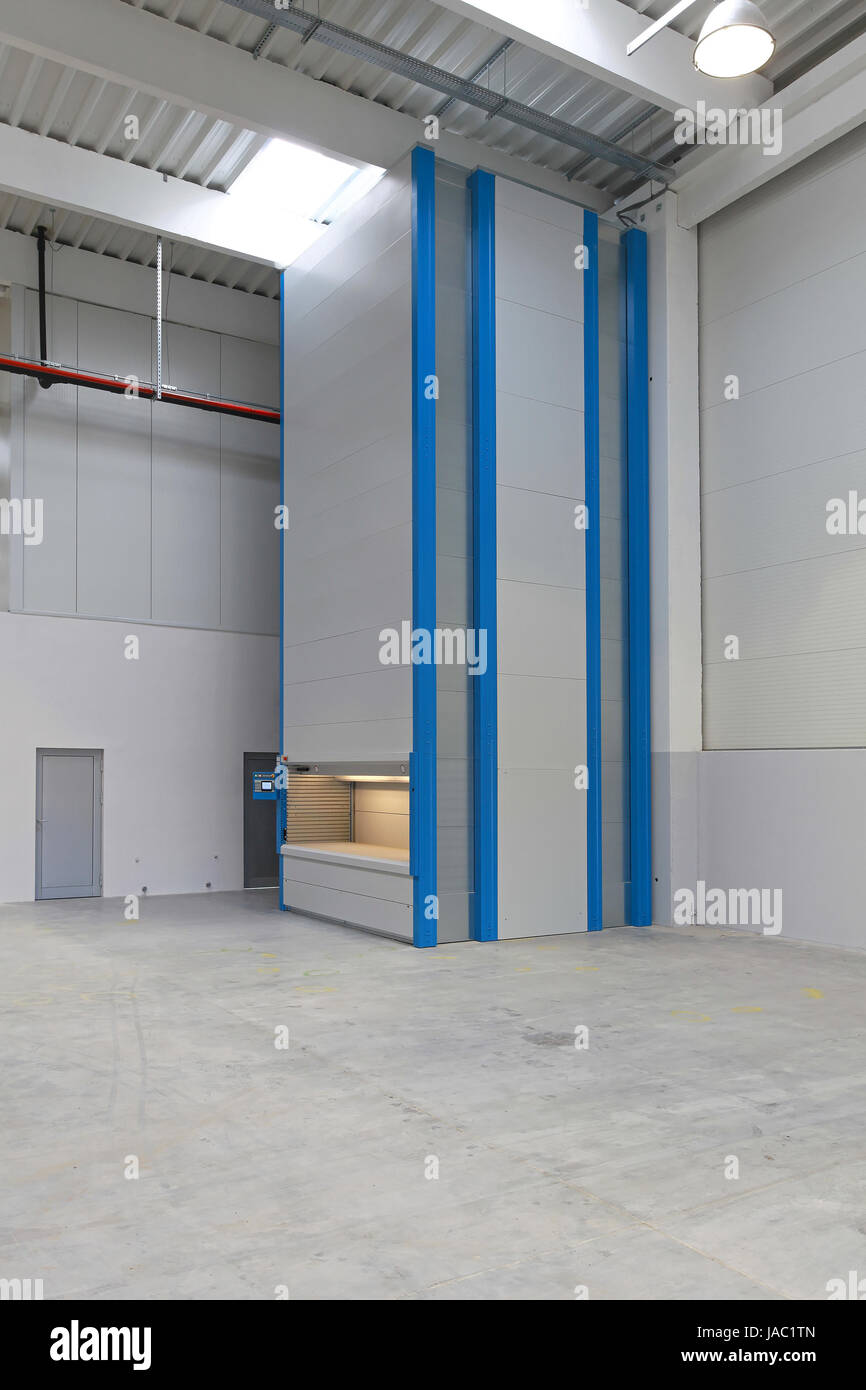 New vertical carousel unit in warehouse Stock Photo - Alamy