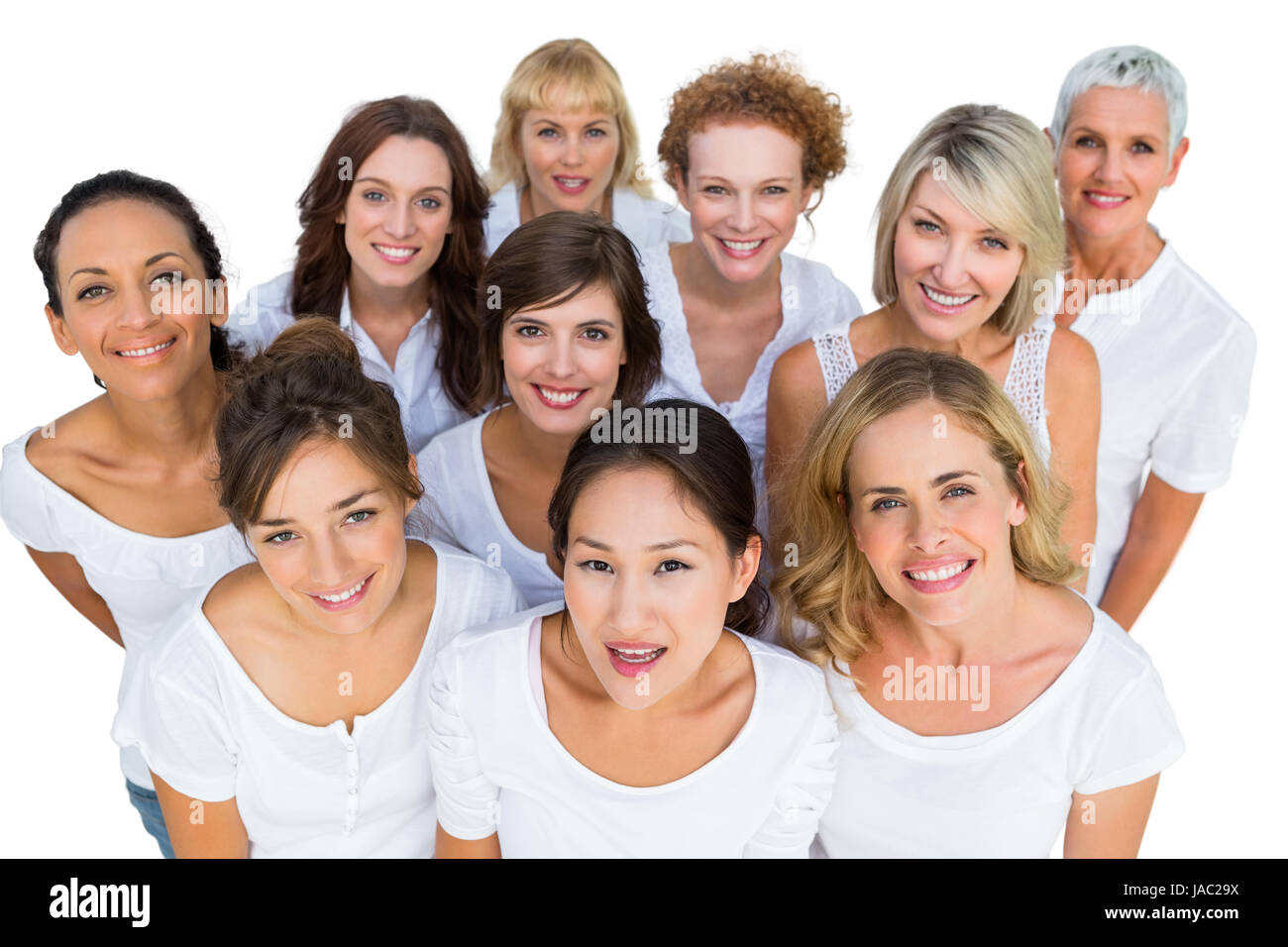 Cheerful female models smiling at camera on white background Stock ...