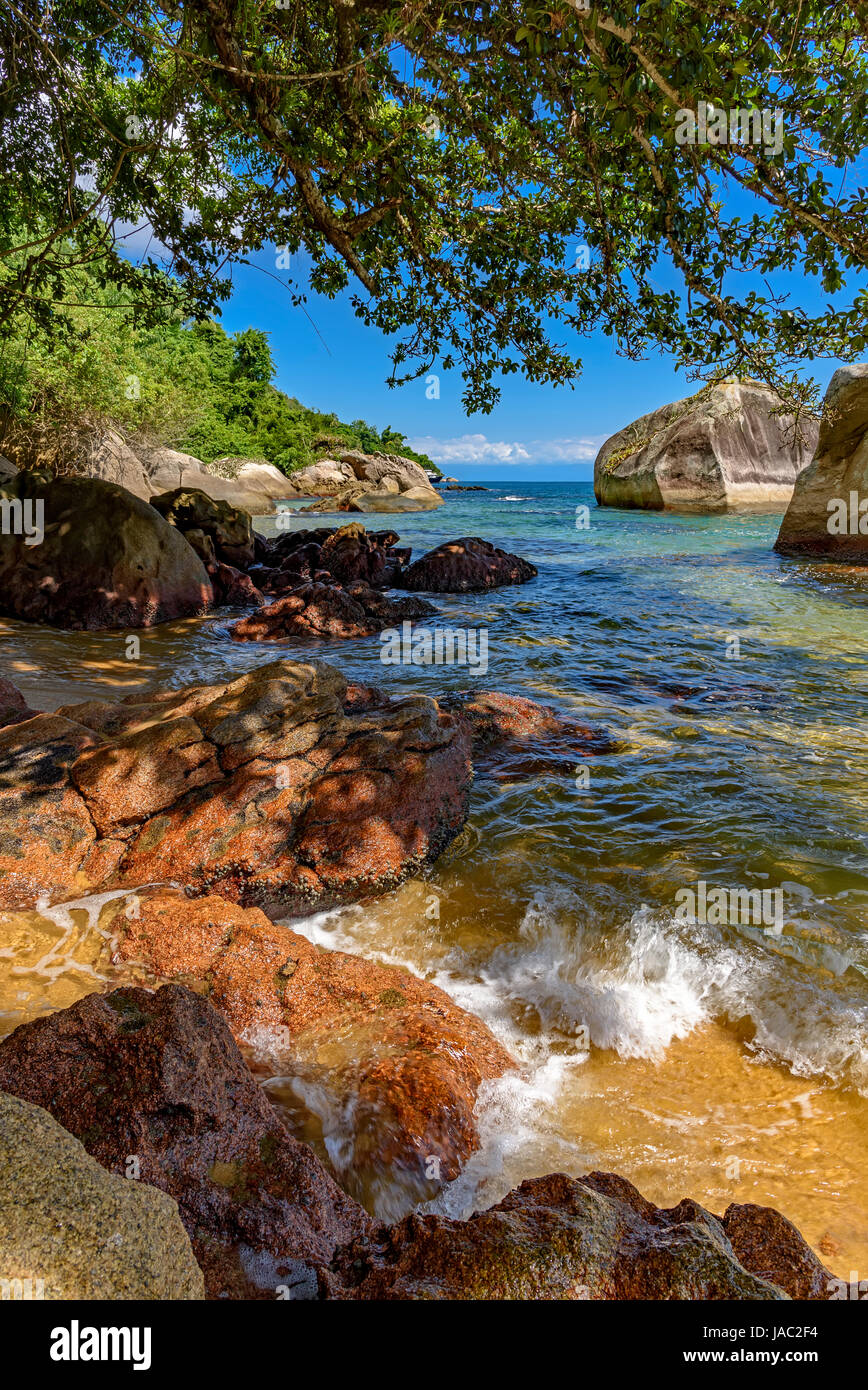 Deserted and unspoilt beach with its limpid and transparent waters that ...