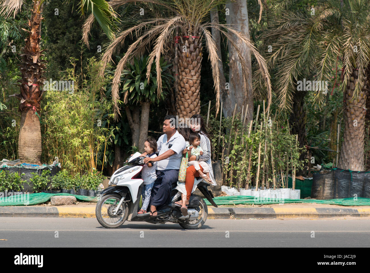 A family ride on a motorbike in Mandalay, Myanmar (Burma Stock Photo ...