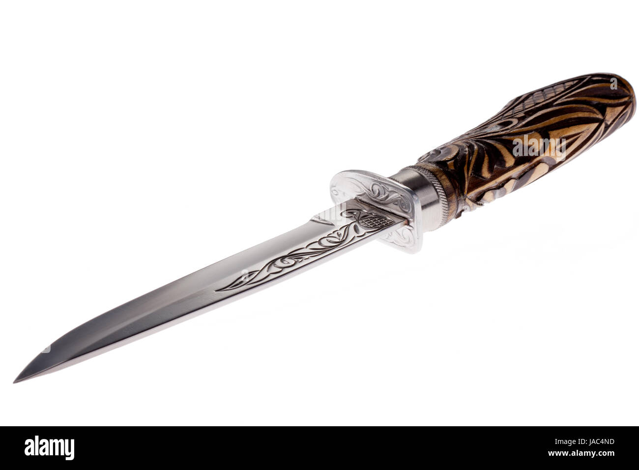 dagger with a wooden handle and engraved blade Stock Photo - Alamy