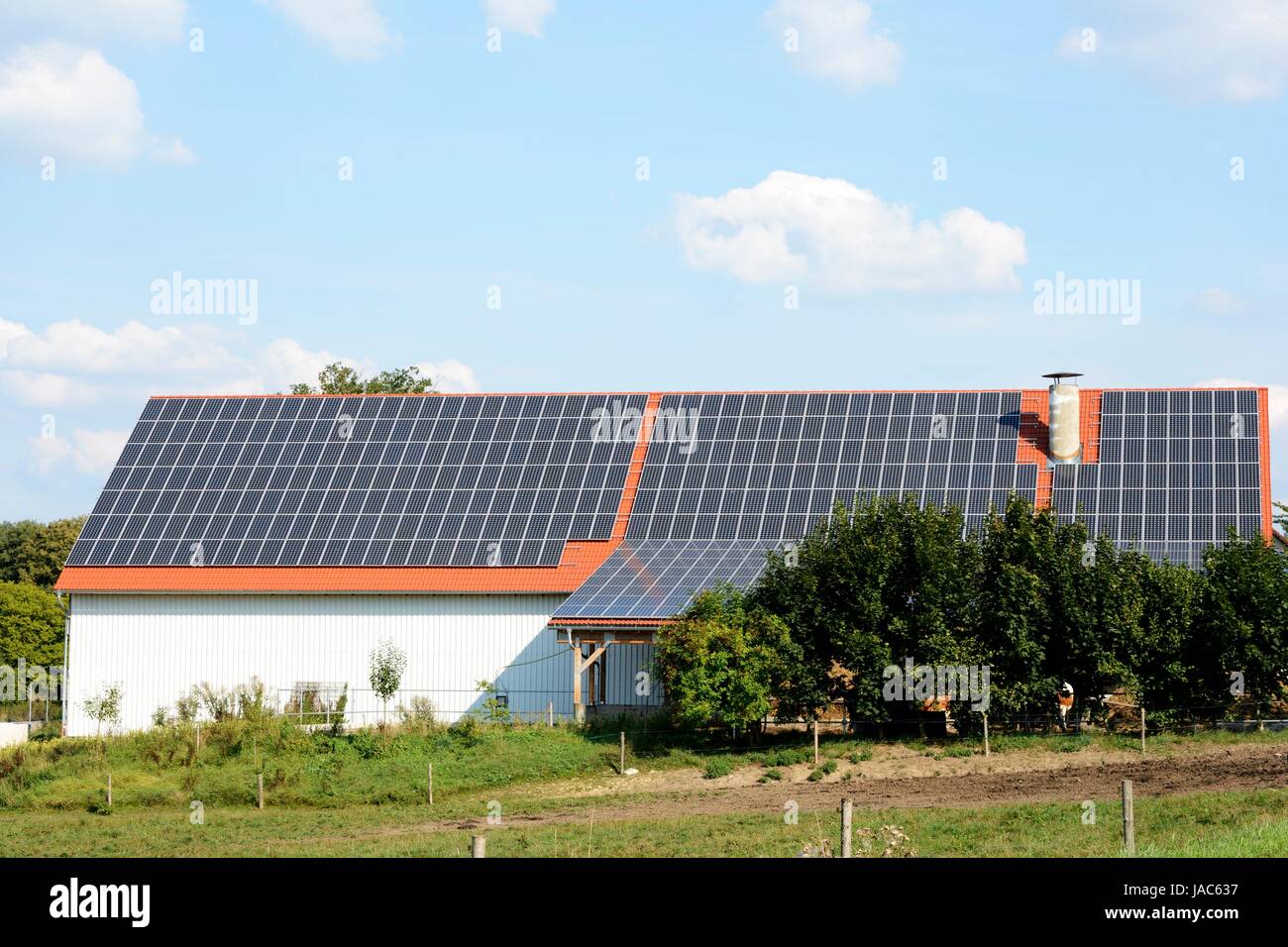 Barn of a farm with solar panels on the roof Stock Photo - Alamy