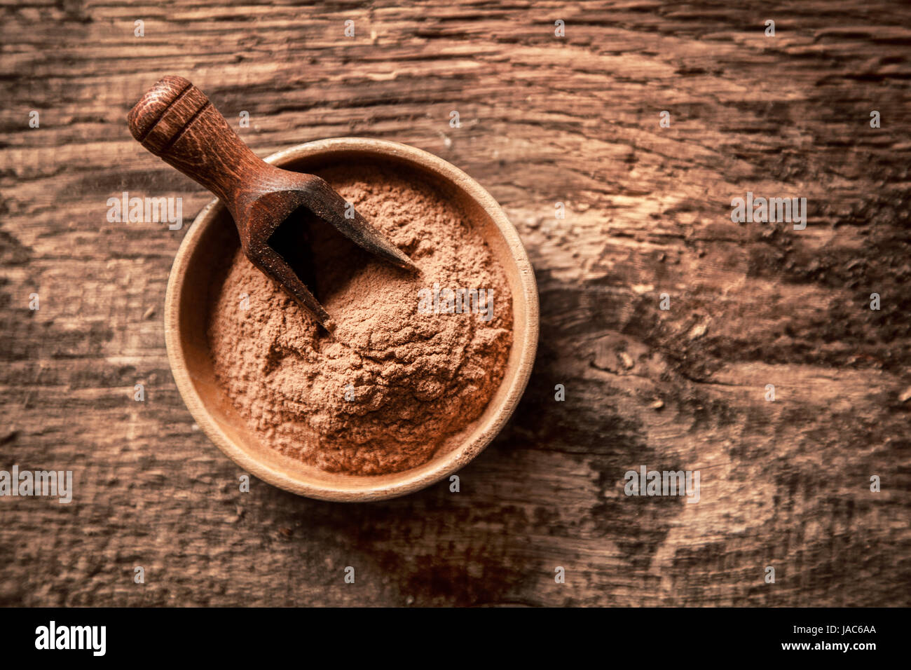 Overhead view of a bowl of finely ground cinnamon powder made from the ...