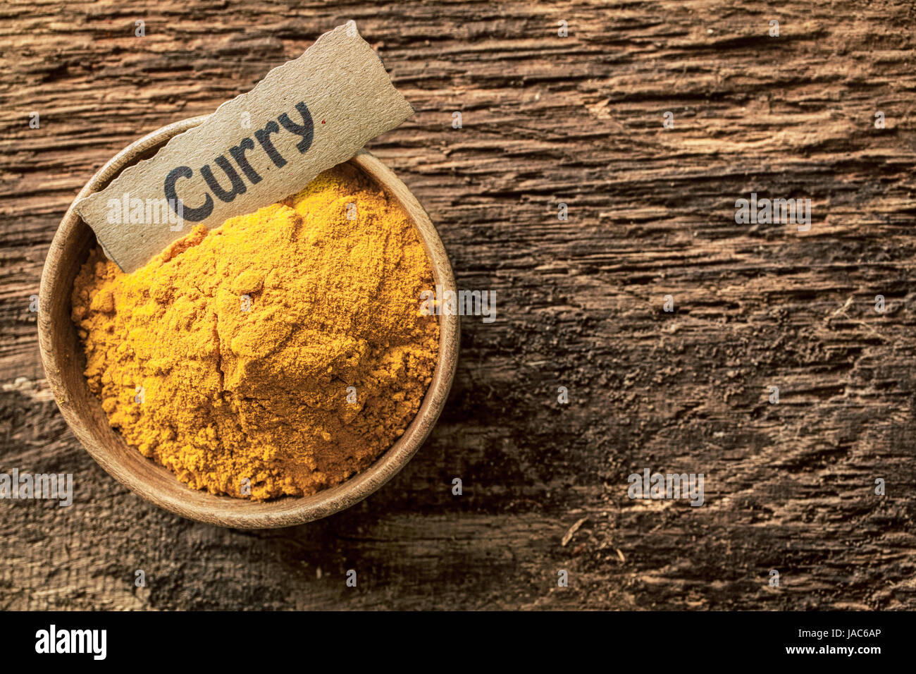 Bowl of curry powder, a traditional blend of masala, turmeric and Asian ...