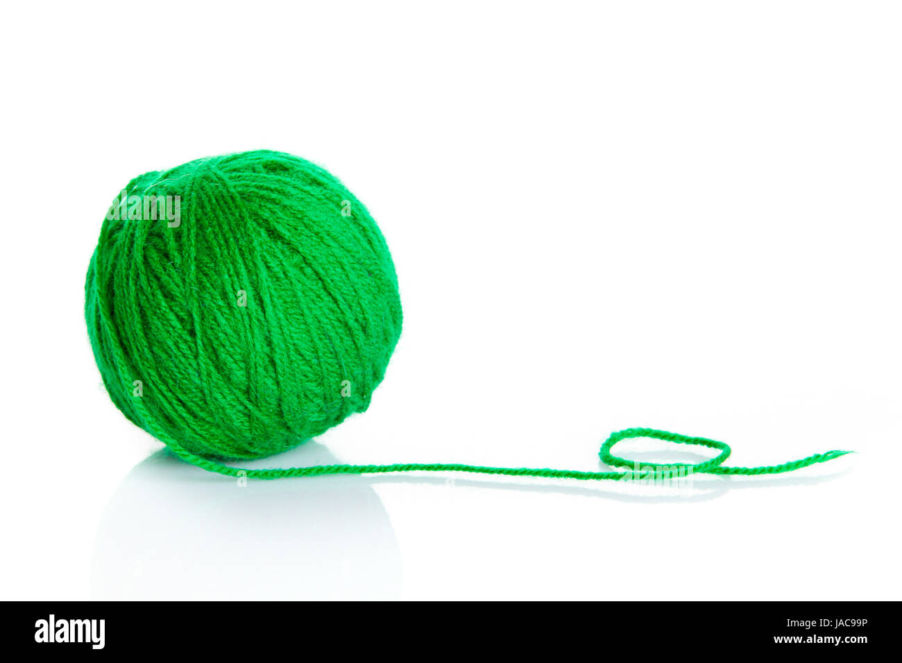Green wool yarn ball isolated on white background Stock Photo - Alamy