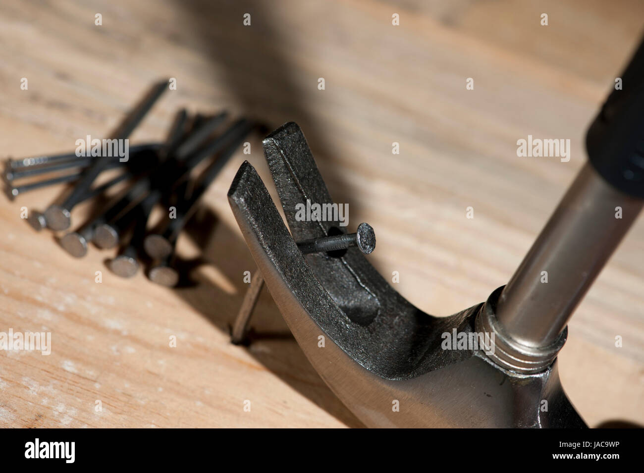 Hammer nail pull hi-res stock photography and images - Alamy
