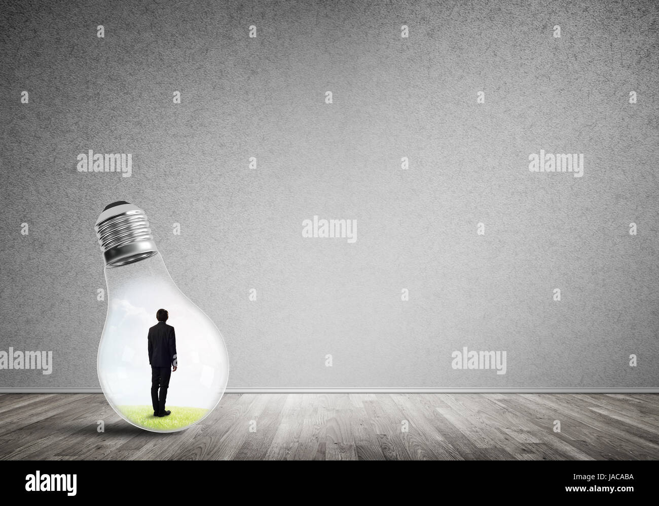 Businessman trapped in bulb Stock Photo - Alamy