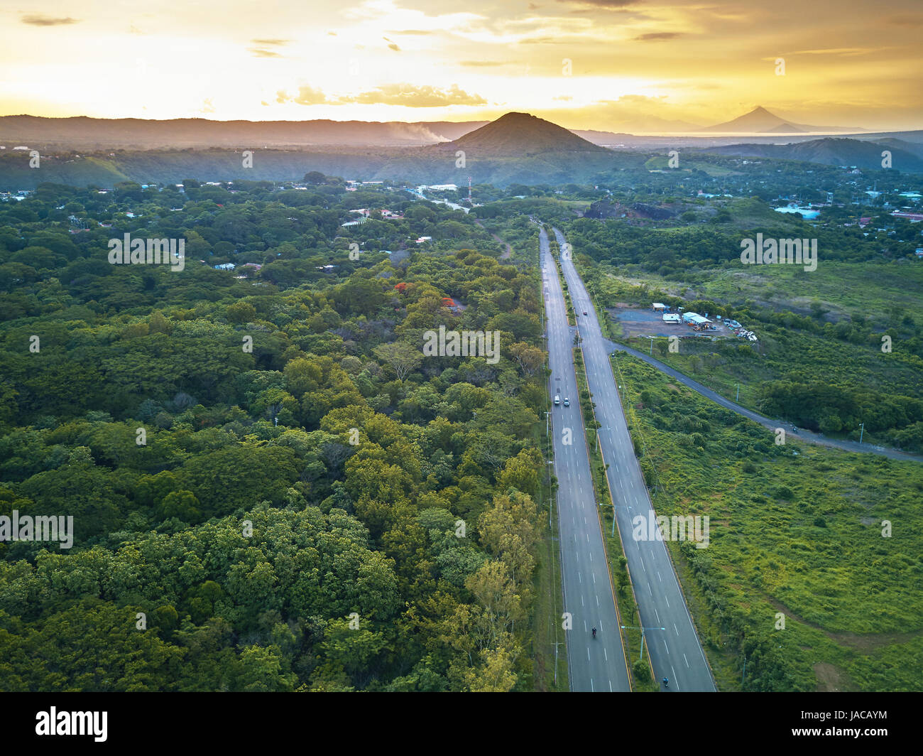 Straight highway road aerial view on sunset dusk time Stock Photo - Alamy