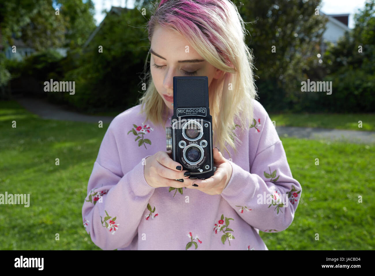 Film camera generation z girl hi-res stock photography and images - Alamy
