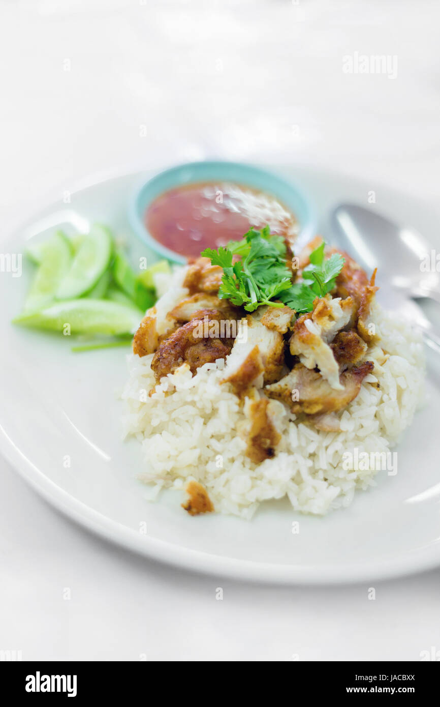 Thai crispy chicken served on steamed rice with sweet chilli sauce and ...