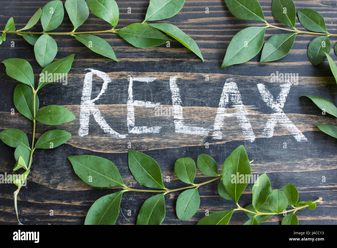 Word relax on rustic wood hi-res stock photography and images - Alamy