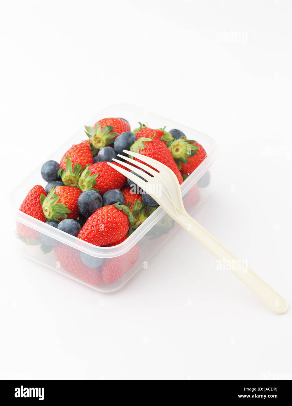 Strawberry and blueberry mix in lunch box Stock Photo - Alamy