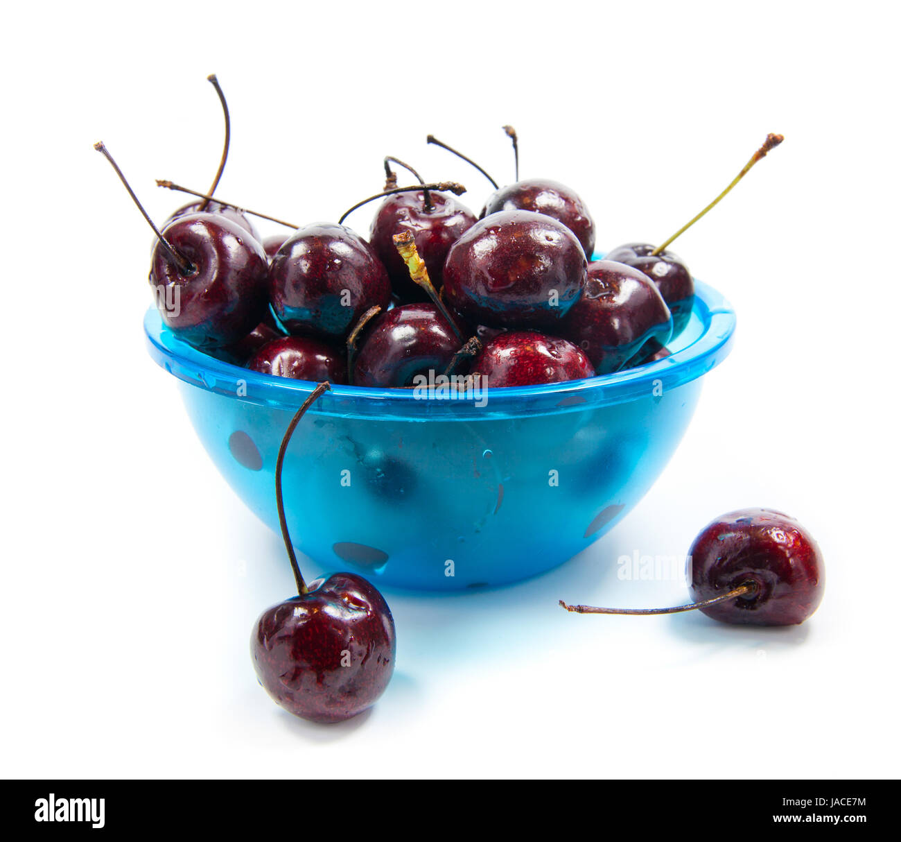 Fresh cherries in bowl isolated on white Stock Photo - Alamy