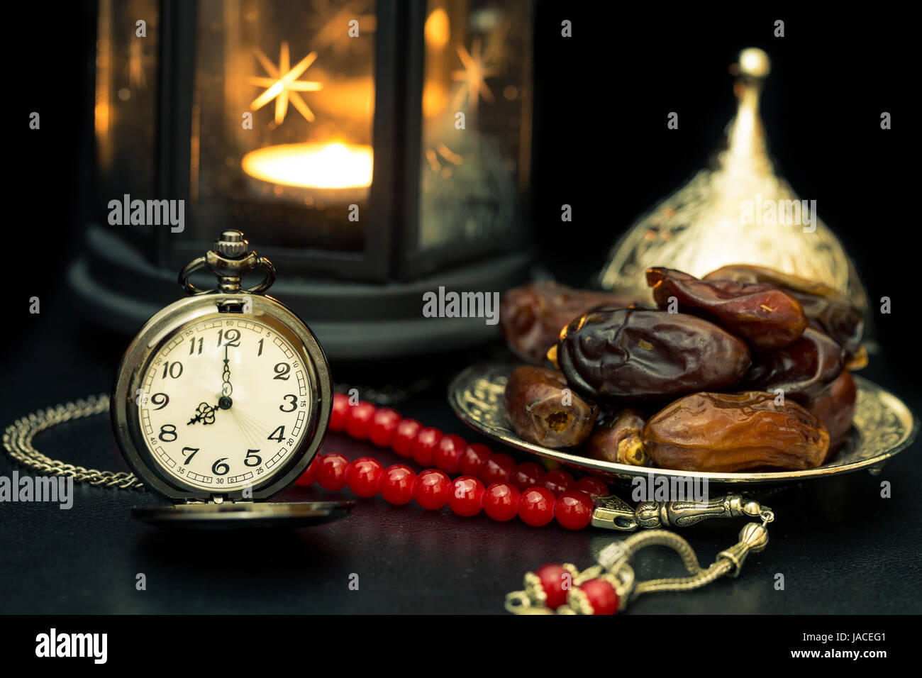 Ramadan concept with dates, pocket watch, rosary and lantern in ...