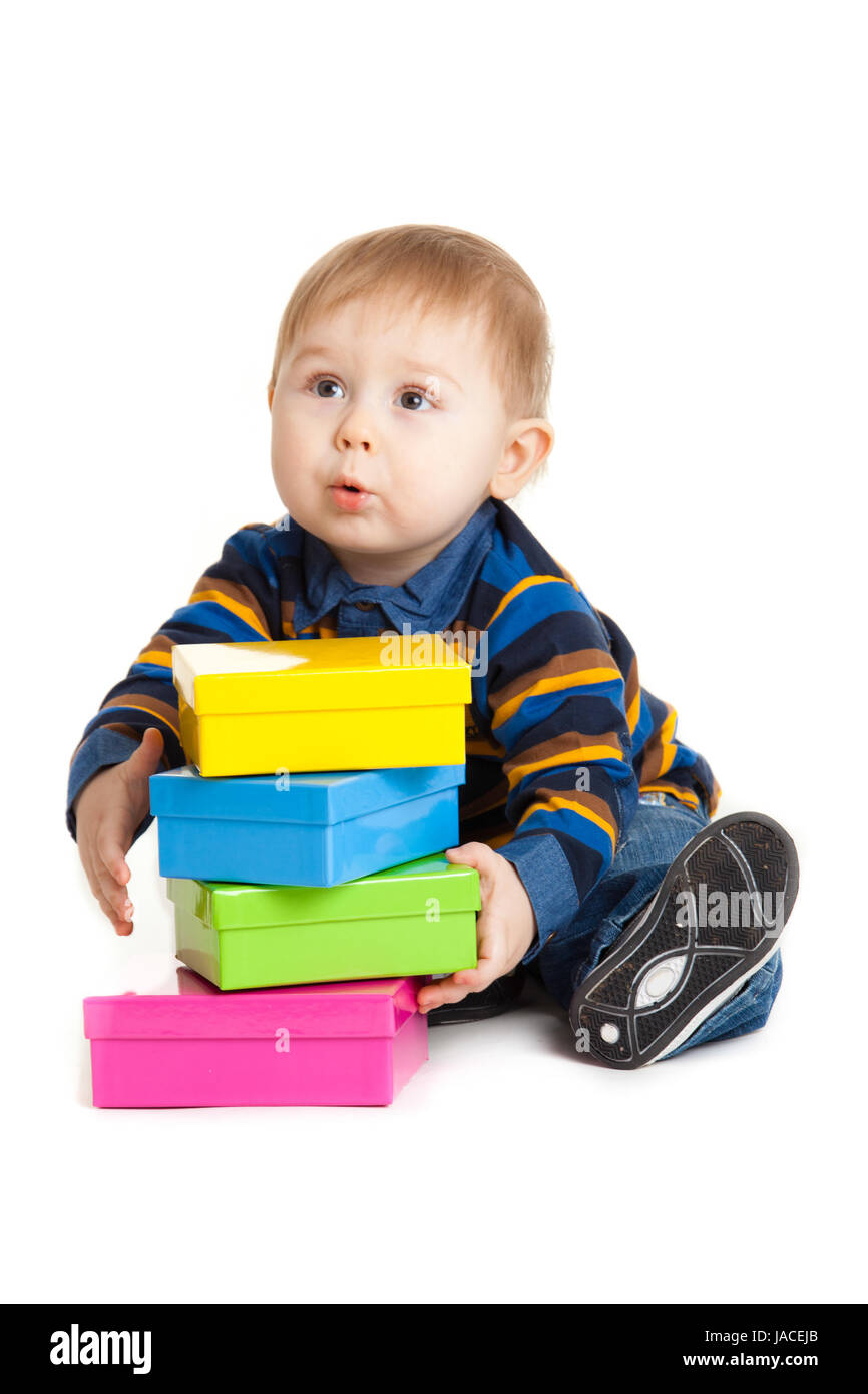 baby boy and gift box isolated on white. Portrait of happy beautiful ...
