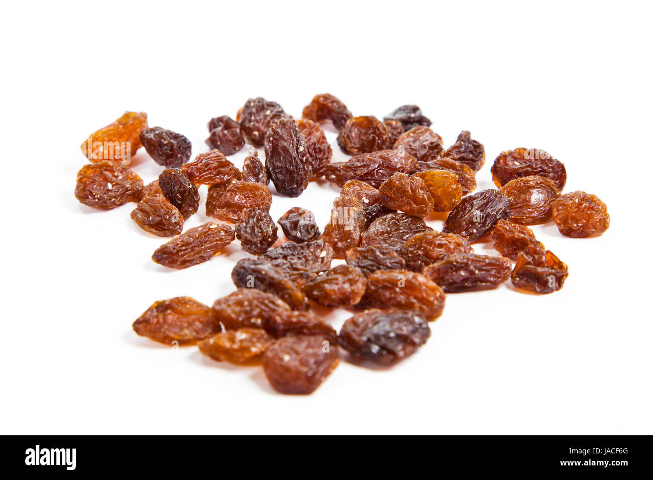 brown raisins on a white background Stock Photo - Alamy