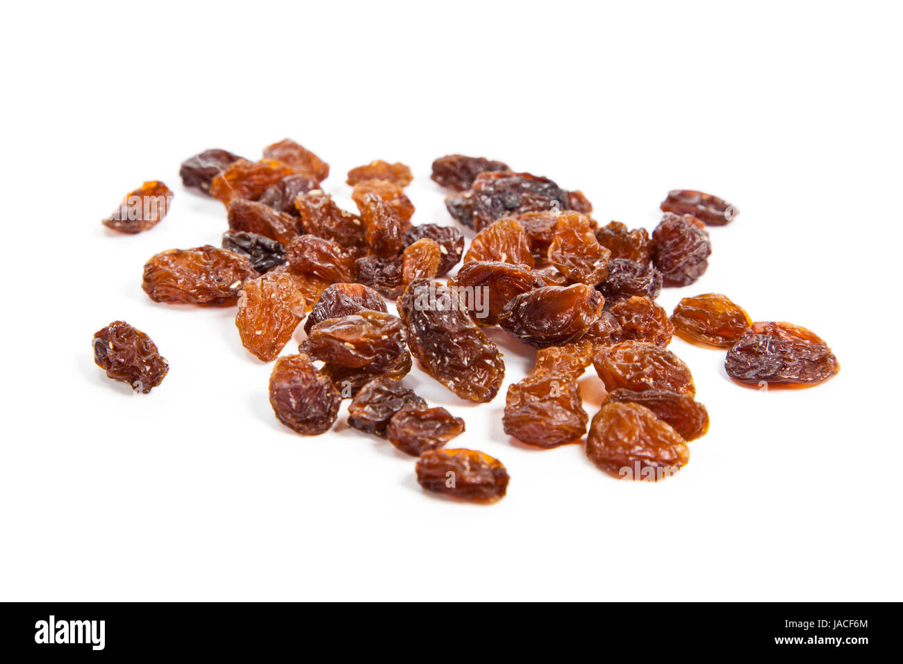 brown raisins on a white background Stock Photo - Alamy