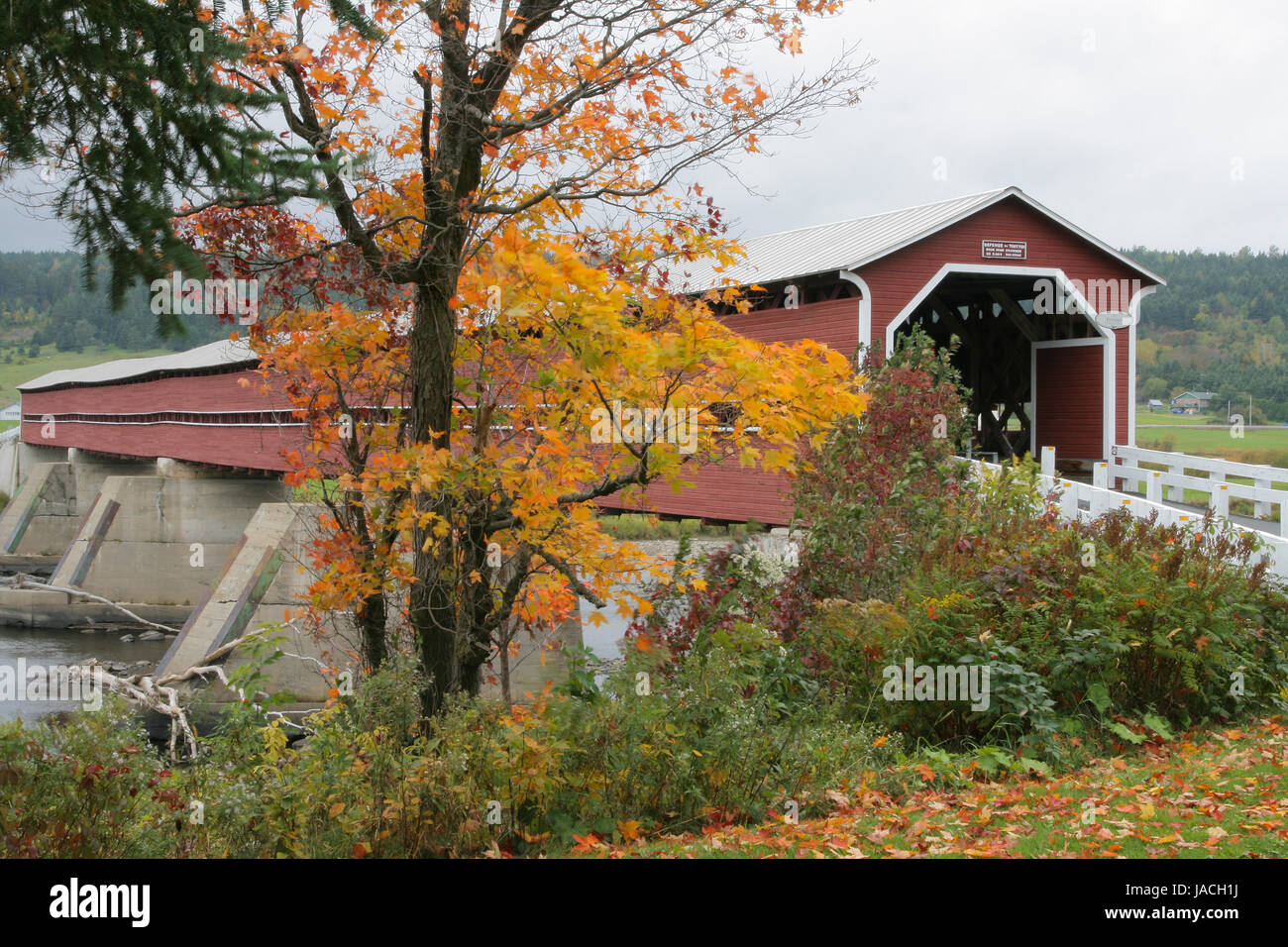 Old red covered bridge located in Beauce, Quebec Canada Stock Photo - Alamy