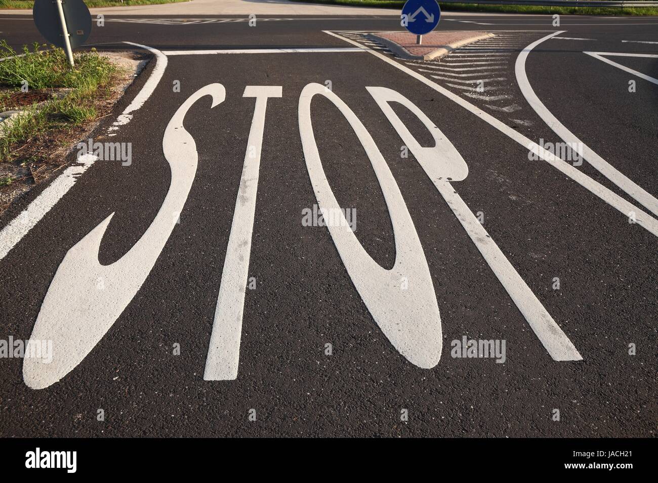Stop sign painted on the road Stock Photo - Alamy