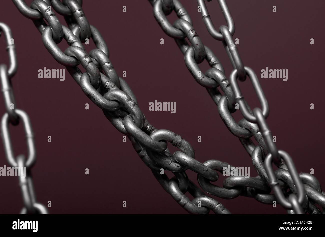 Hanging metal chains close up Stock Photo - Alamy