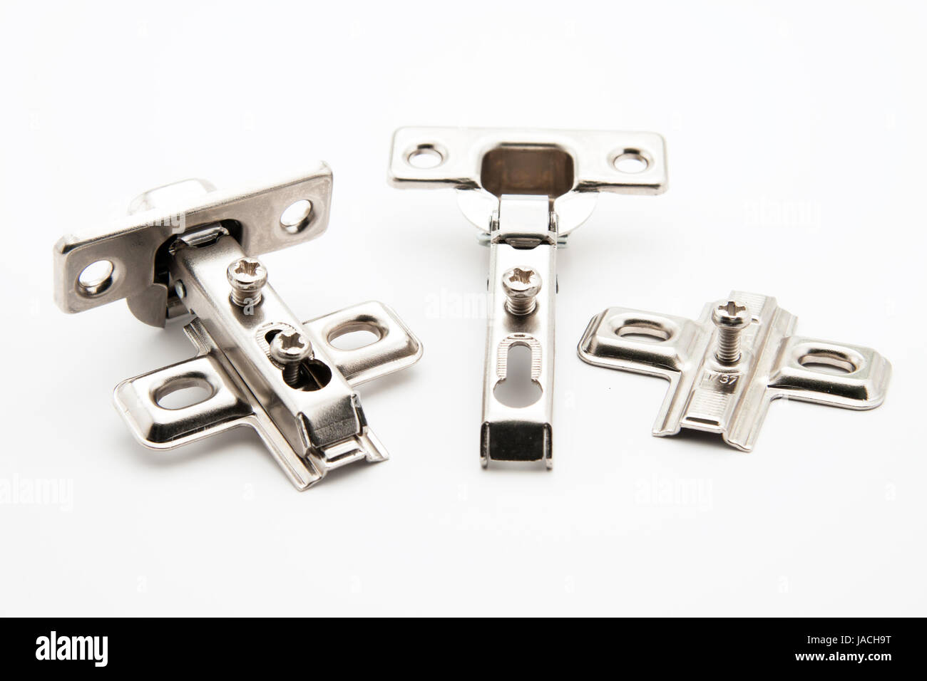 Furniture door hinge connectors on white background Stock Photo - Alamy