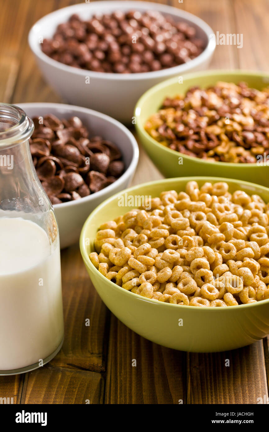 various sweet cereals in ceramic bowls Stock Photo - Alamy