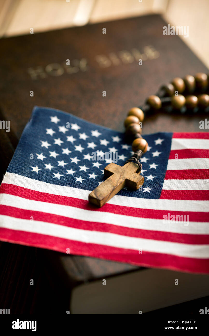 holy bible with american flag and wooden crucifix Stock Photo - Alamy