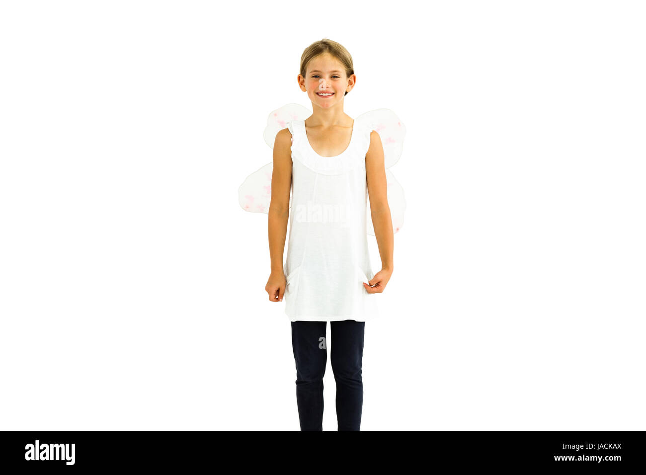 Smiling young girl posing on white background Stock Photo - Alamy