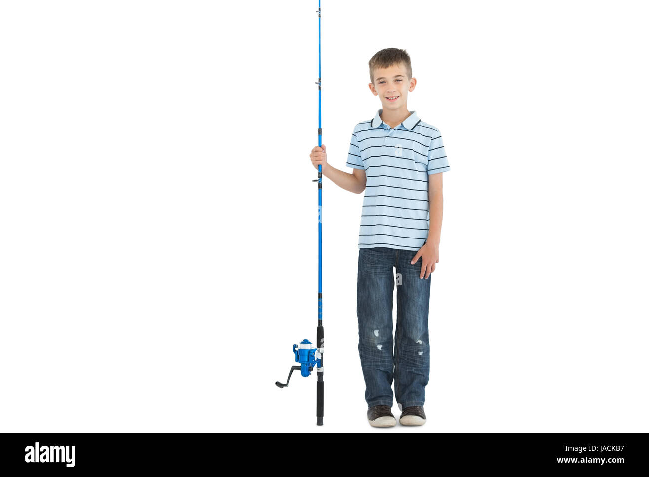 Smiling young boy holding fishing rod posing on white background Stock ...