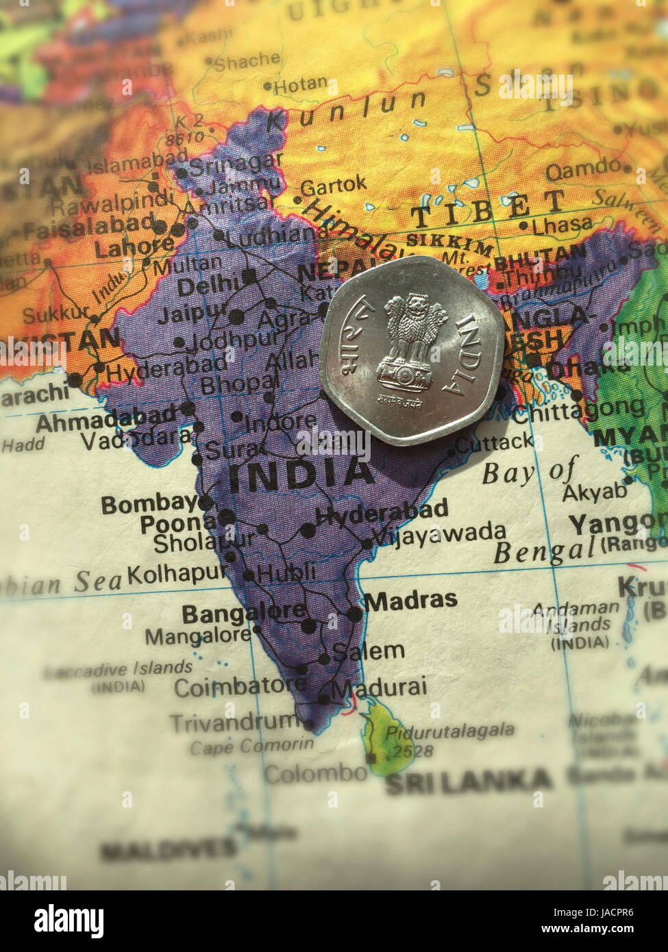 Indian Rupee Coin on World Map Still Life Stock Photo - Alamy