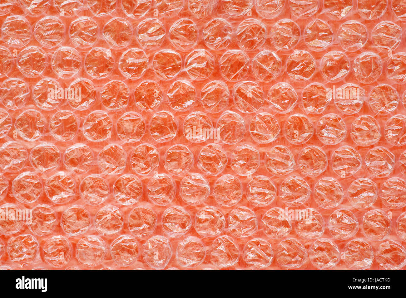 Orange air bubble wrap close up. Plastic surface of shock proof packing ...