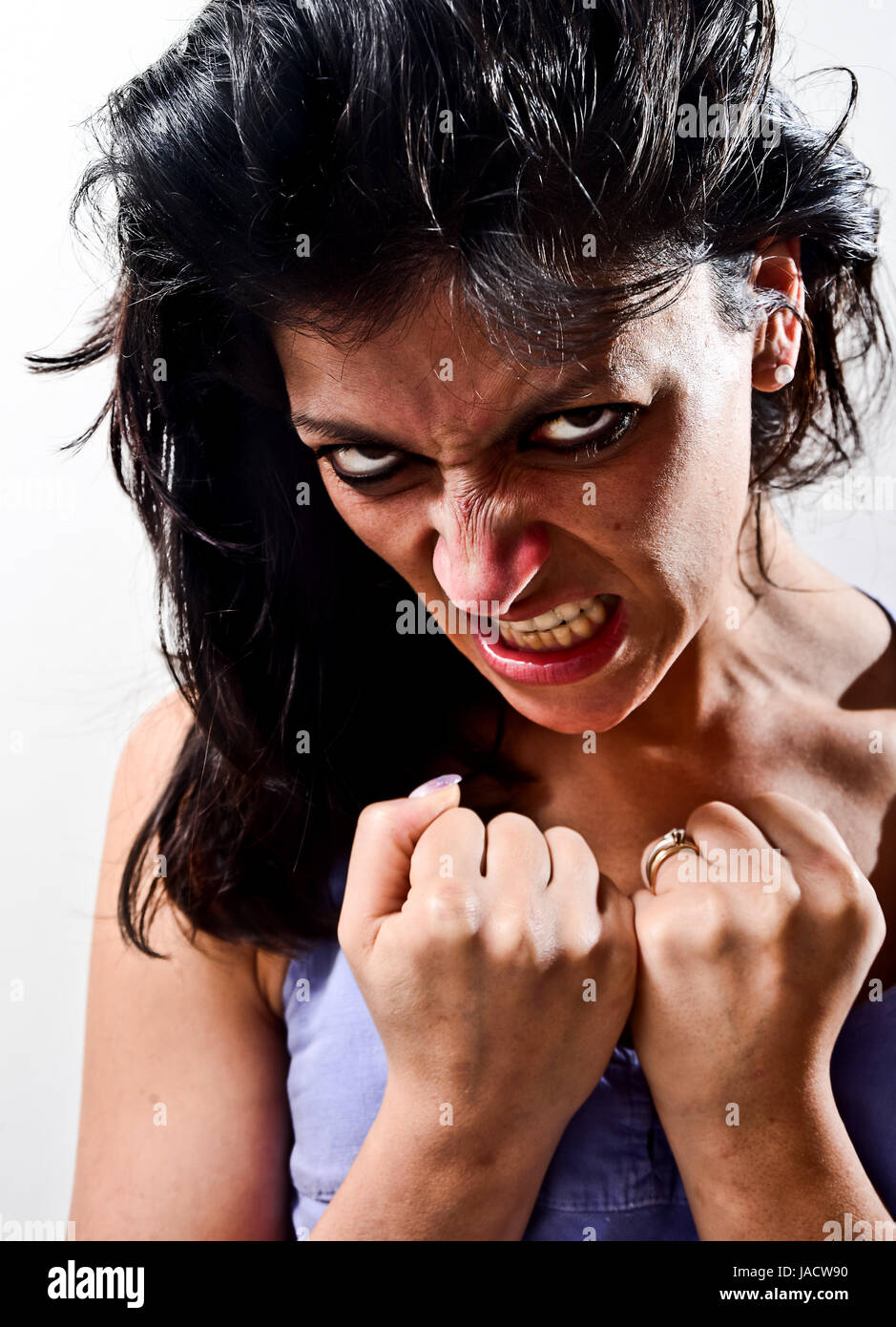 Angry woman in a position of self-defense Stock Photo - Alamy
