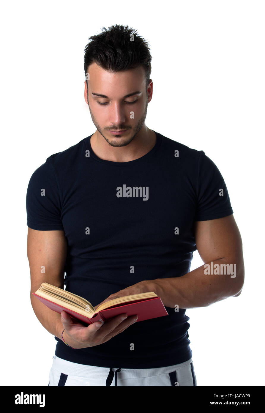 Handsome and athletic young man reading book, isolated on white ...