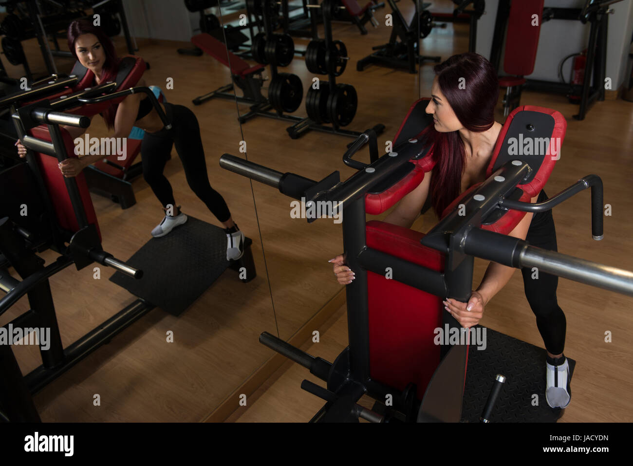 Attractive Woman Doing Leg With Machine In Gym - Leg Exercises Stock ...
