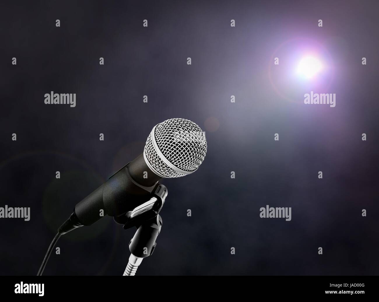 Microphone on Stage with Spotlight Stock Photo - Alamy