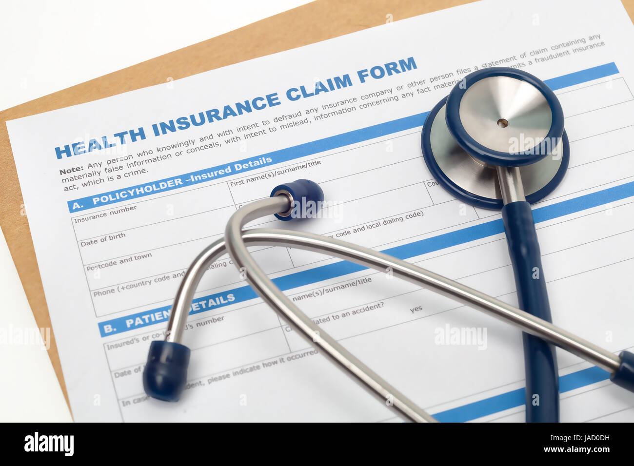 Medical reimbursement with health insurance claim form and stethoscope ...