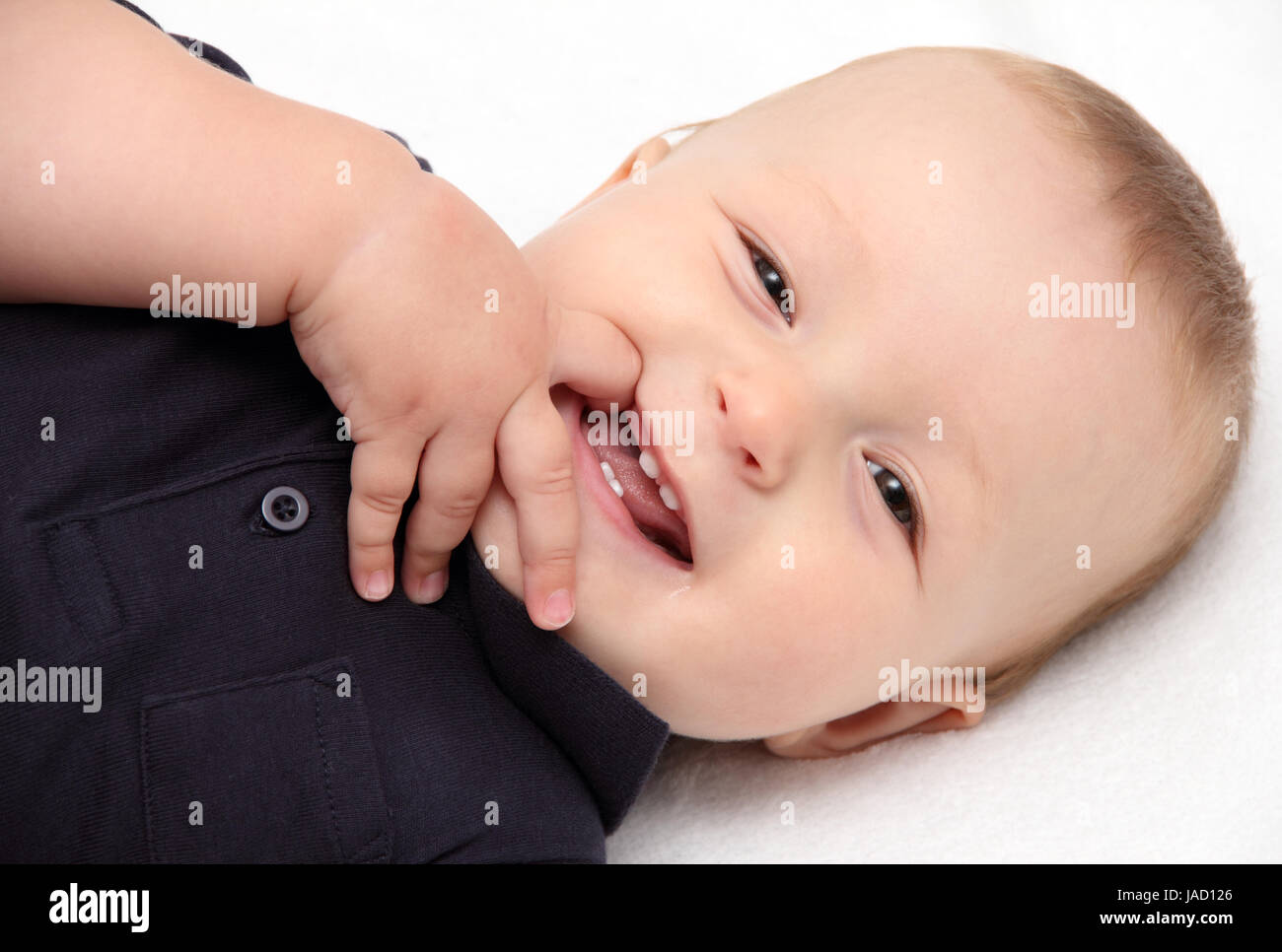 Happy baby on back Stock Photo - Alamy