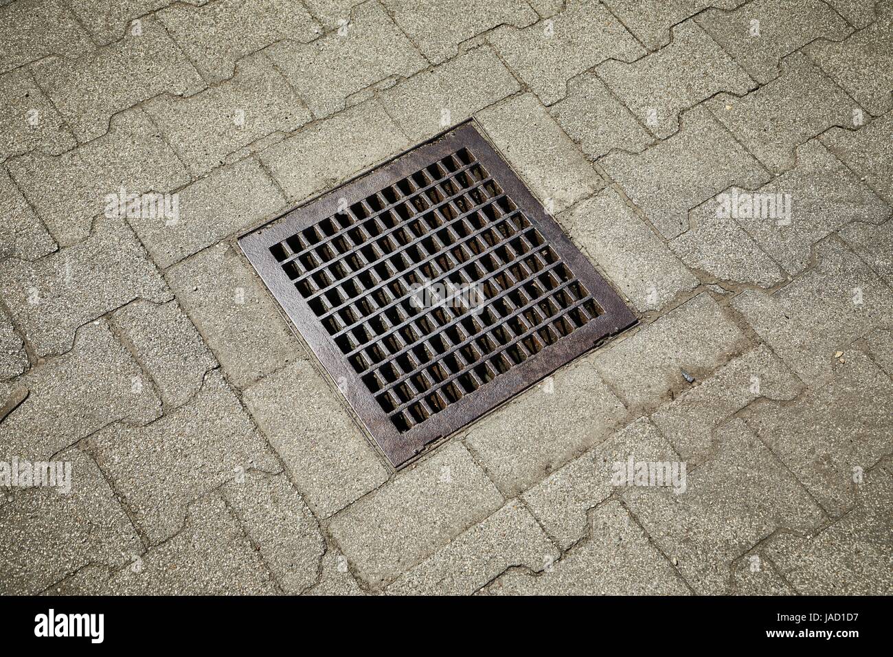 Sewer pit cover Stock Photo - Alamy