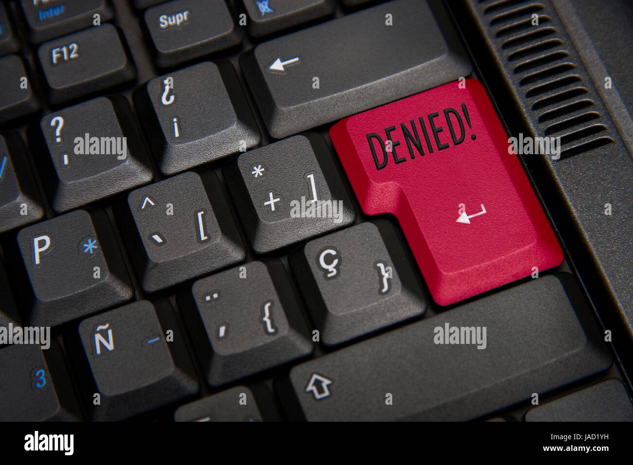 Black keyboard with red key and word denied Stock Photo - Alamy