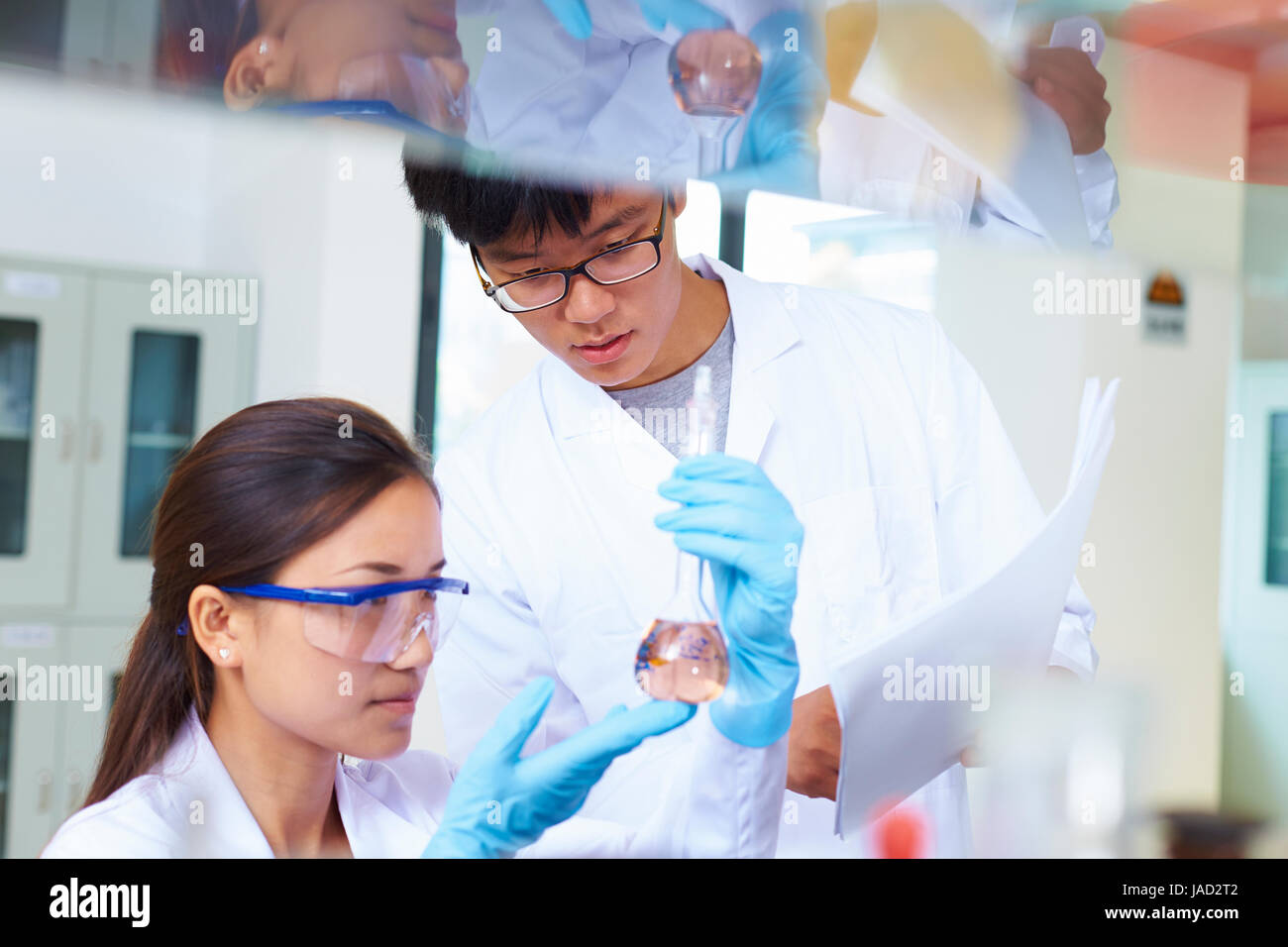 Two Chinese Laboratory scientist working at lab with test tubes Stock ...